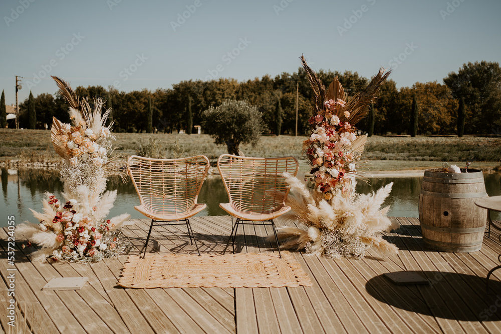 secular ceremony lay ceremony by the lake with nude and pink floral ...