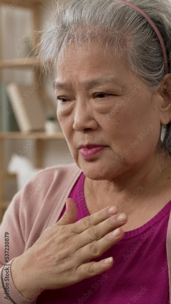 Vertical Screen: closeup view of an unwell asian grandma getting lung ...