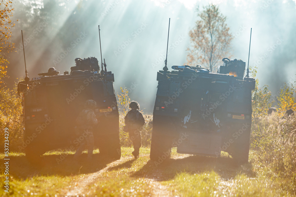 Foto de Military training on the battlefield with armored vehicles ...
