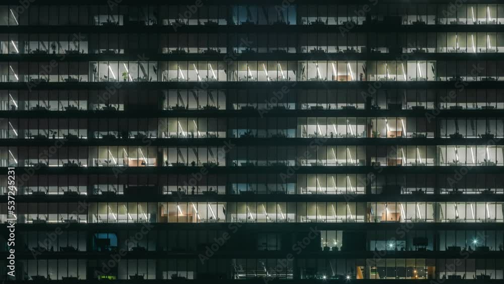 Day to night transition blinking office window lights time-lapse ...