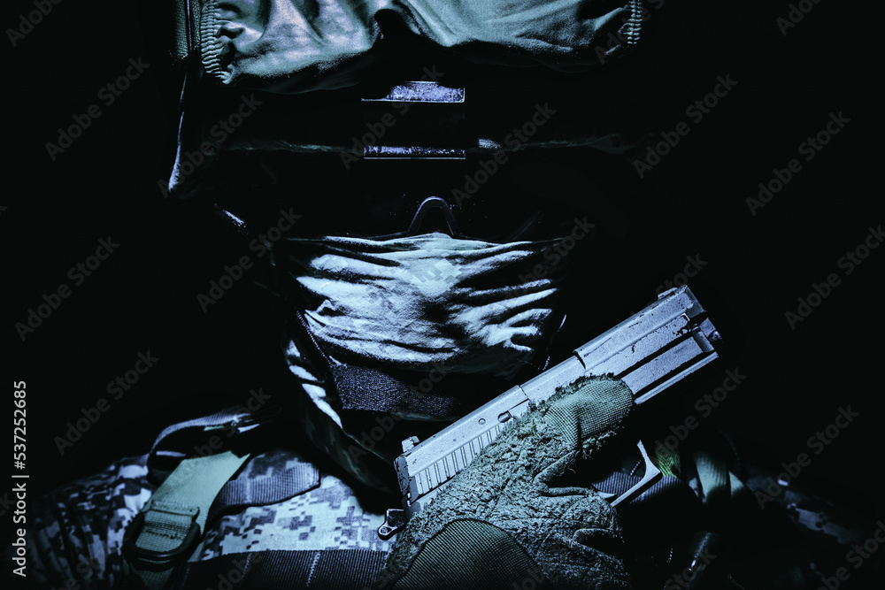 Special operations forces soldier in combat helmet with hidden behind ...