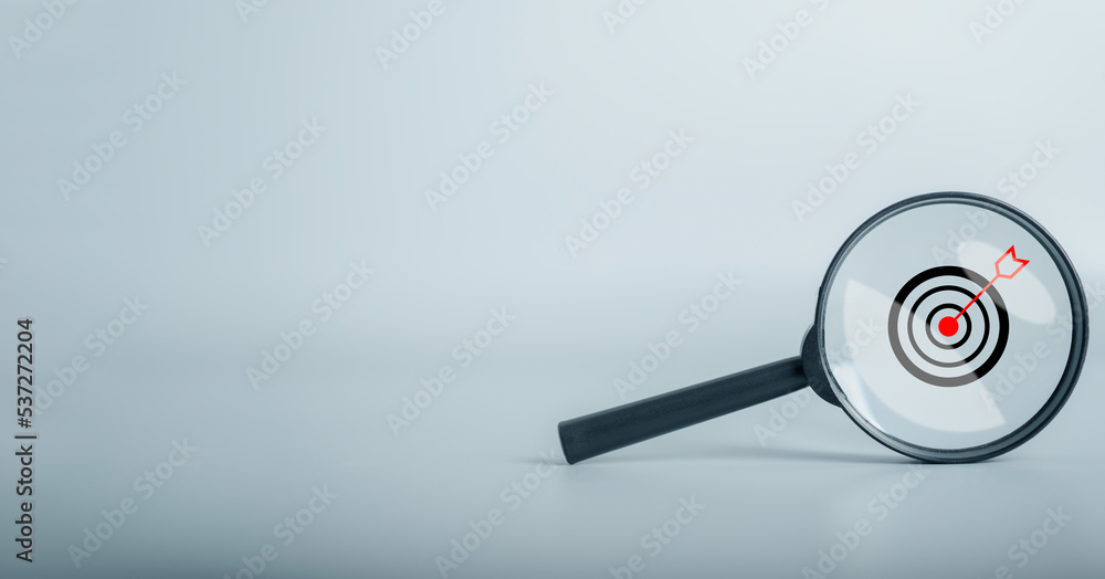 Magnifying glass searching focus to Success and business goal target ...