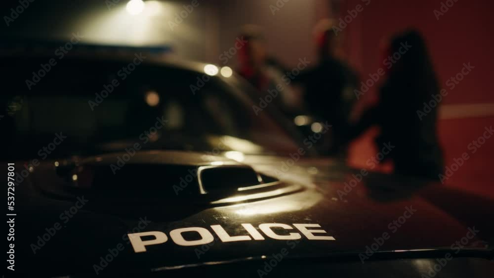Video Stock Cinematic Focus on Patrol Car: Two Police Officers Arrest ...