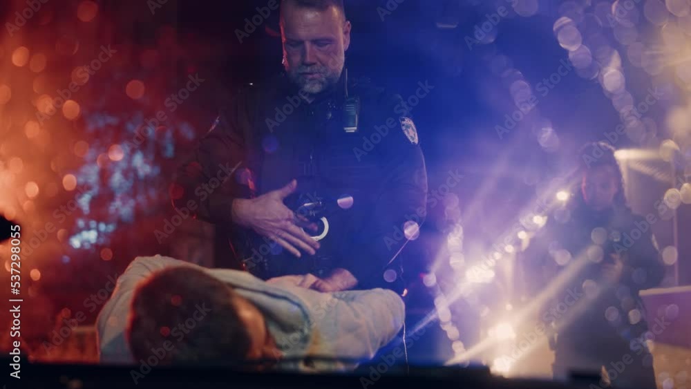 Two Police Officers Arrest Suspect, Put Him on a Patrol Сar Hood ...