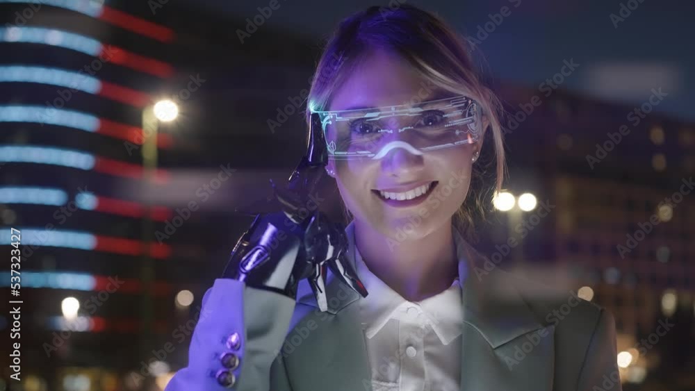 Cinematic footage of a business woman with cyborg bionic arm and ...