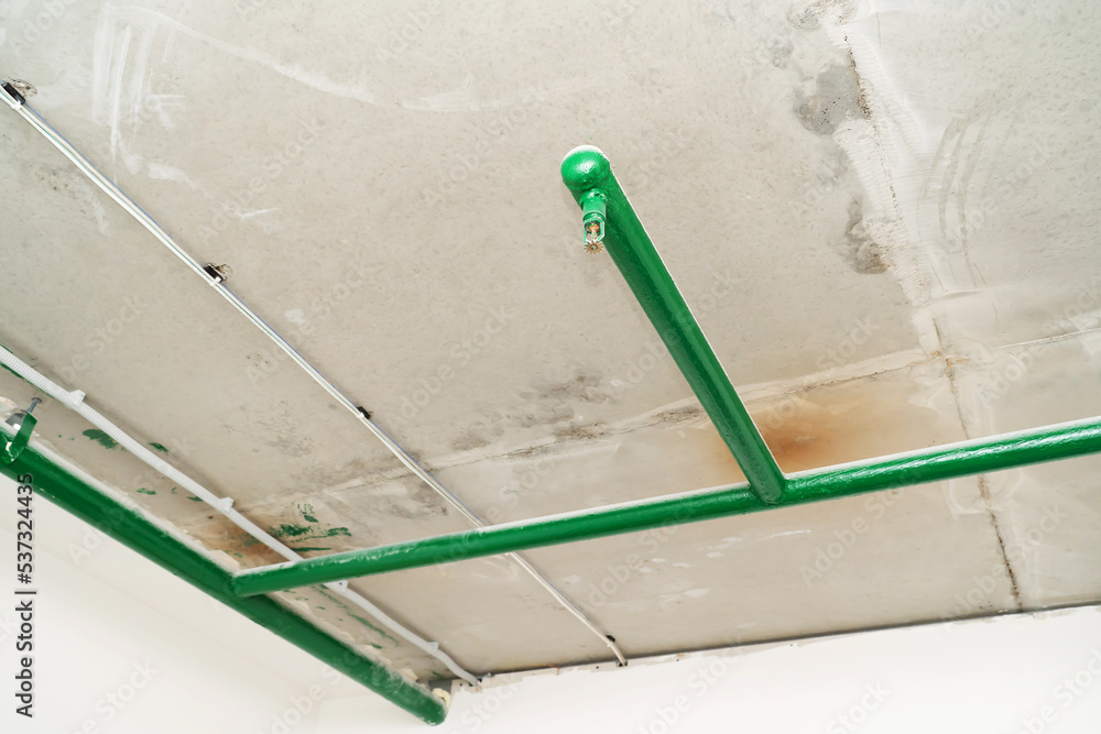 Installation of a fire extinguishing system. Metal pipes with valves ...