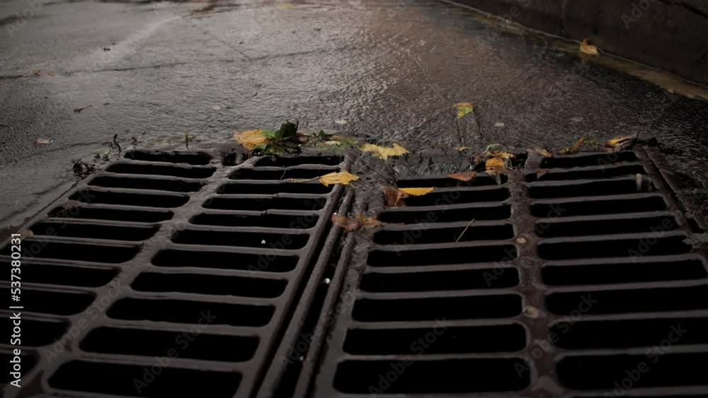 Rainwater drainage system. Rain precipitation flowing into a storm ...