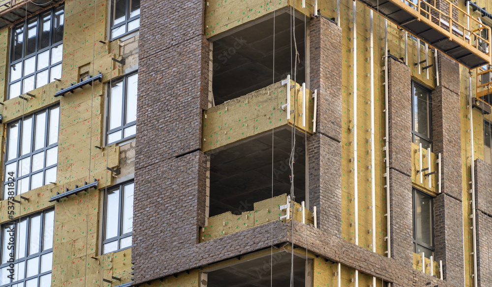 Monolithic concrete frame of apartment building under construction with ...