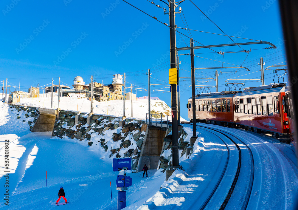 ZERMATT, SWITZERLAND - January 01, 2022: Train on mountain rack railway ...