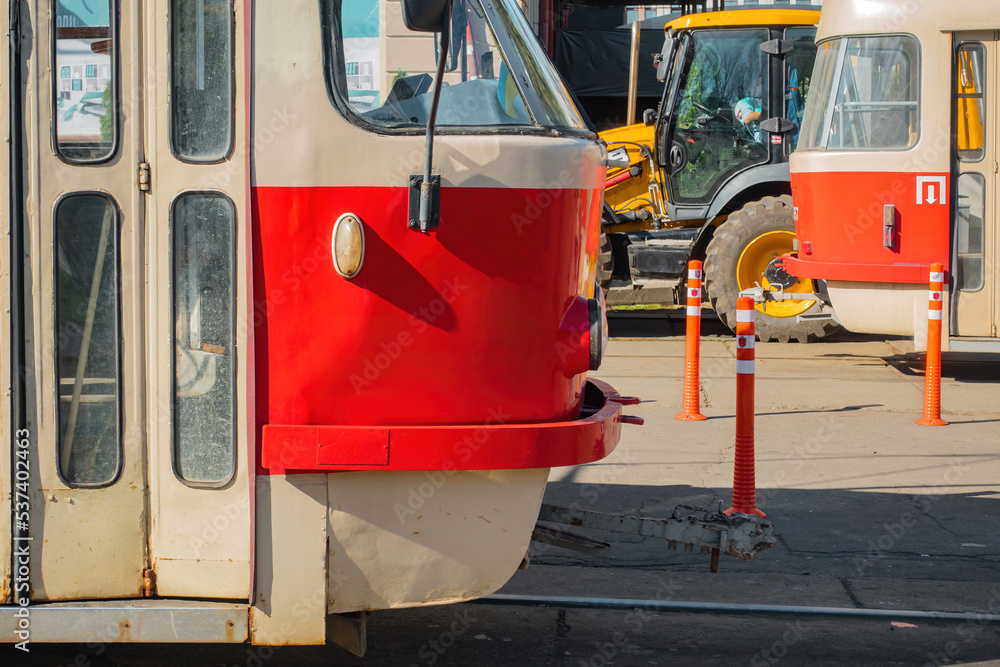 Red vintage trams stands on the rails on the city's street. Journey ...
