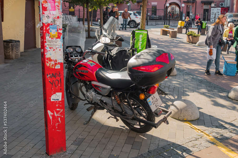 Kyiv, Ukraine - Jun 25, 2022: Motorcycle with a box from the behind ...