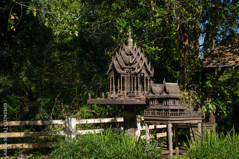 Old wooden structure of the spirit house or Shrine of the household god ...
