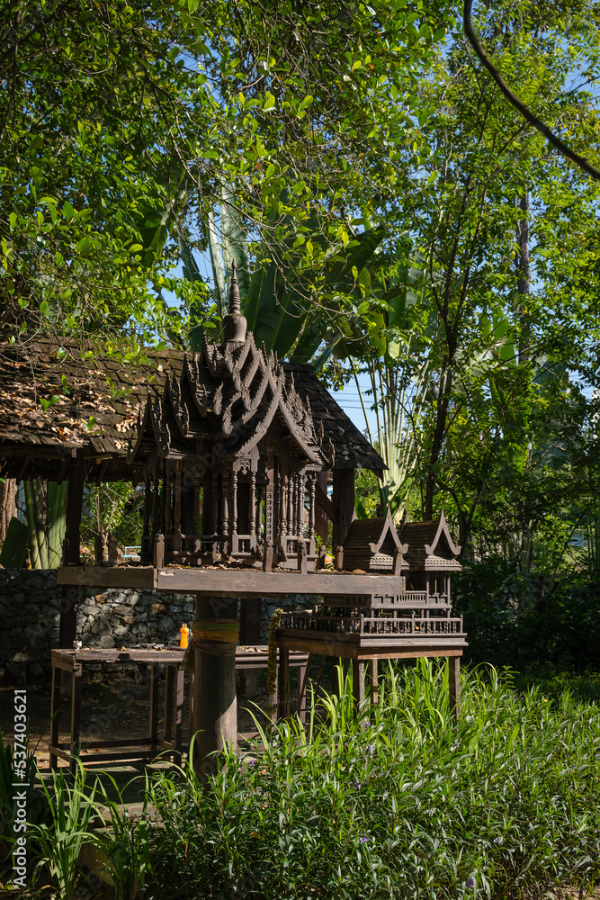 Old wooden structure of the spirit house or Shrine of the household god ...