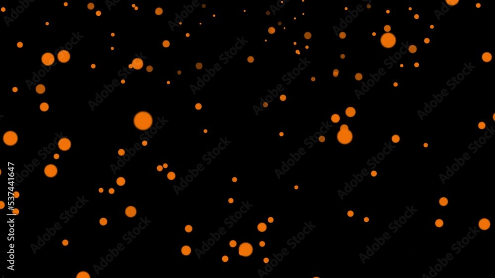ORANGE particles glowing on the black background. Black background with ...