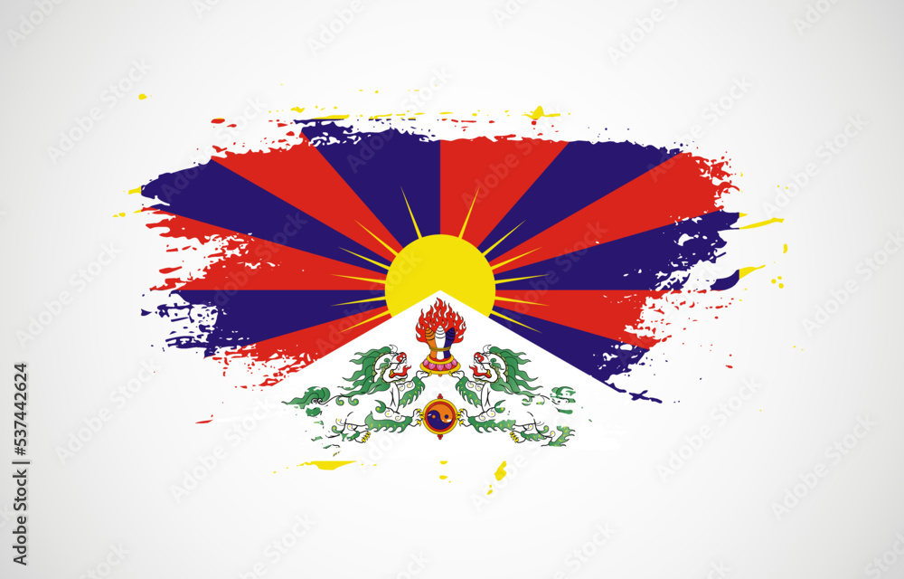 Grunge brush stroke with the national flag of Tibet on a white isolated ...