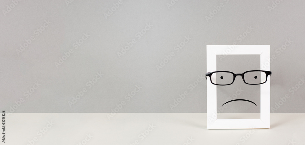 Frame with a sad face, mental health concept, negative mindset ...