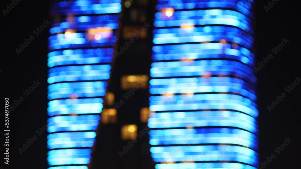 Close-up. Office building with glowing windows against the background ...