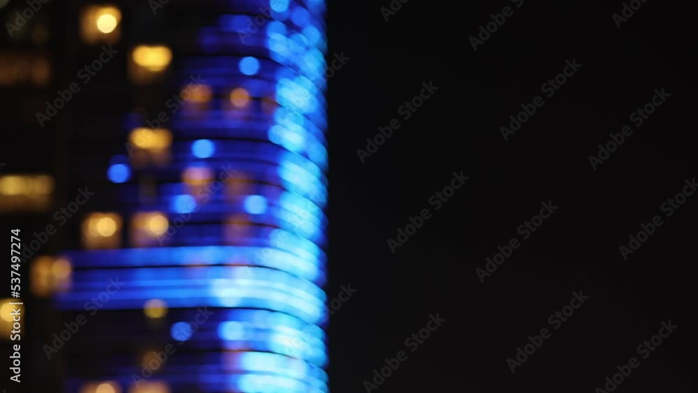 Close-up. Office building with glowing windows against the background ...