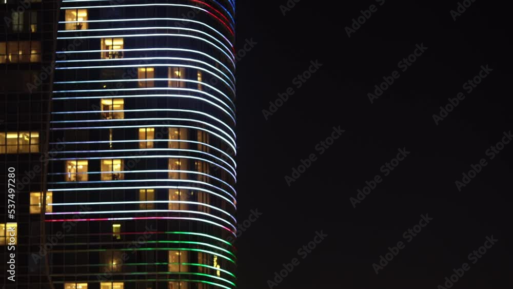 Close-up. Office building with glowing windows against the background ...