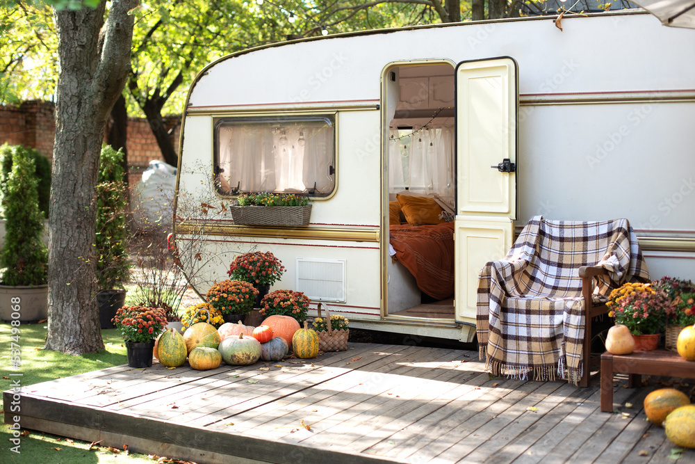 Wooden RV house porch with garden furniture. Campsite in garden. Wooden ...