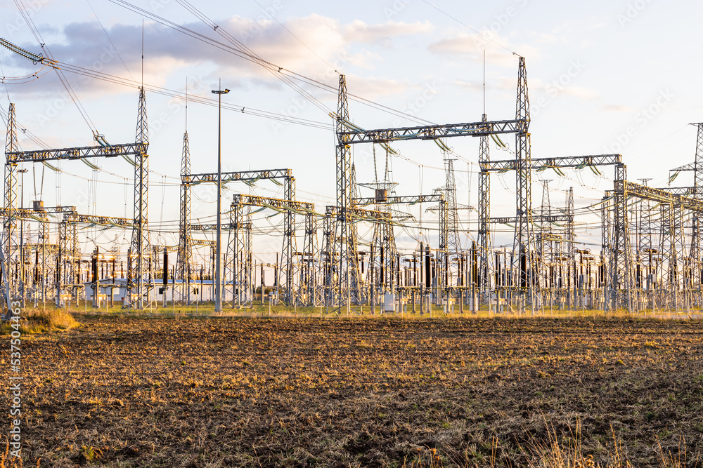 High voltage electricity towers, transmission power lines, and ...