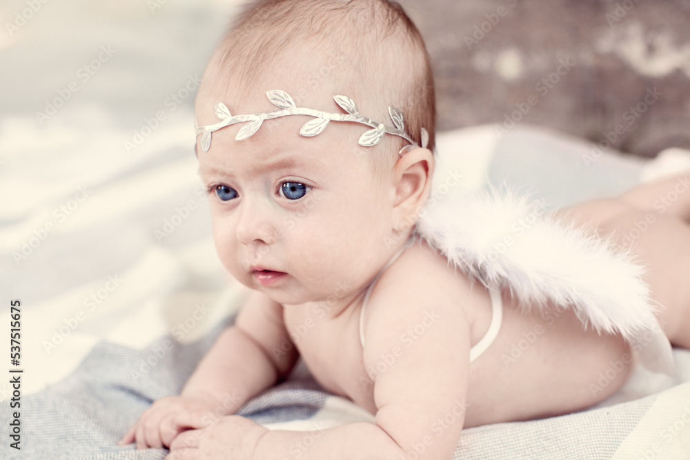 newborn baby girl with blue eyes a laurel wreath in her hair and angel ...