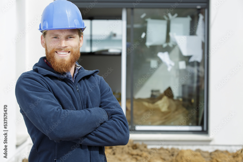 man wearing safety helmet stood outside a residential property Stock ...