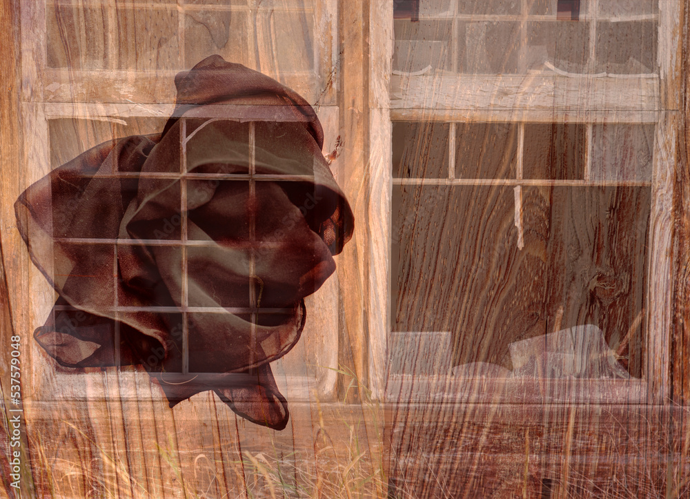 Halloween Witch inside old out building. This is a overlay of a hooded ...