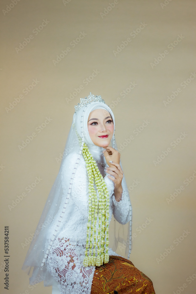 beautiful model, wearing hijab, Javanese Indonesian wedding dress in an ...