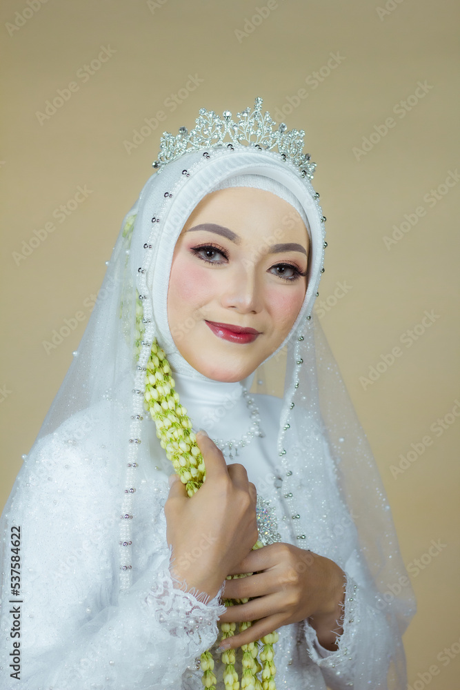 beautiful model, wearing hijab, Javanese Indonesian wedding dress in an ...