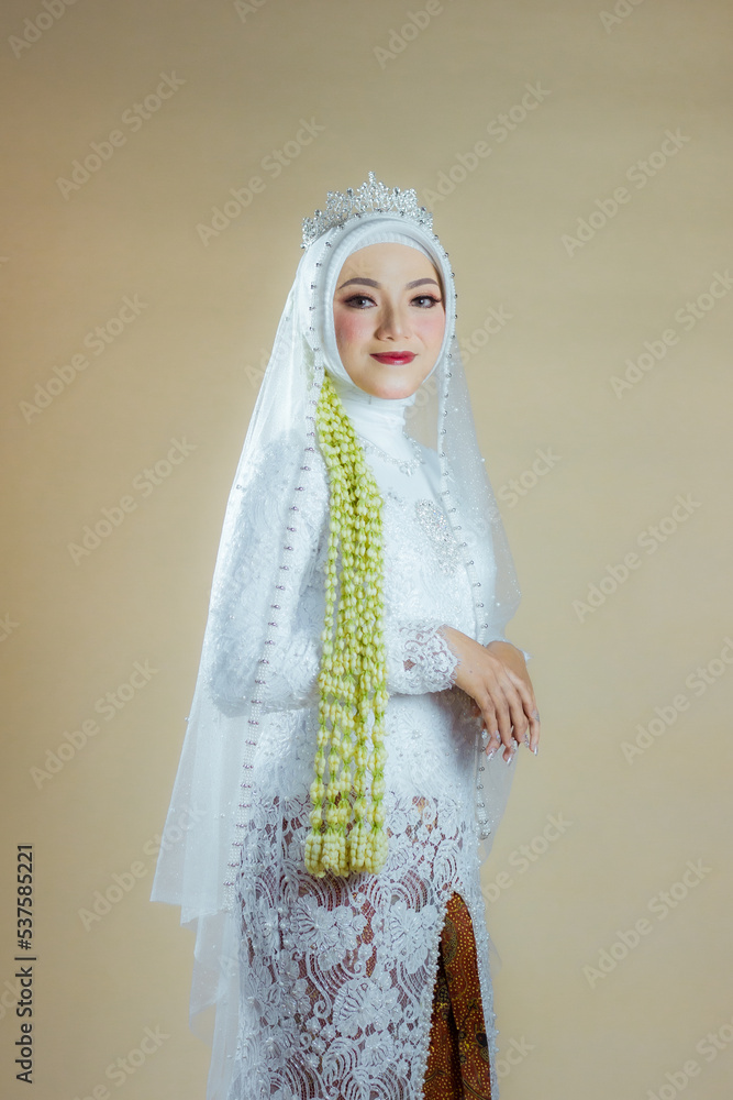 beautiful model, wearing hijab, Javanese Indonesian wedding dress in an ...