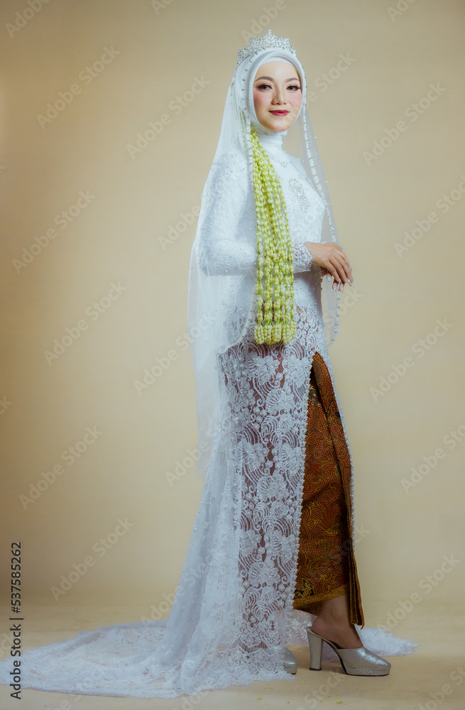 beautiful model, wearing hijab, Javanese Indonesian wedding dress in an ...