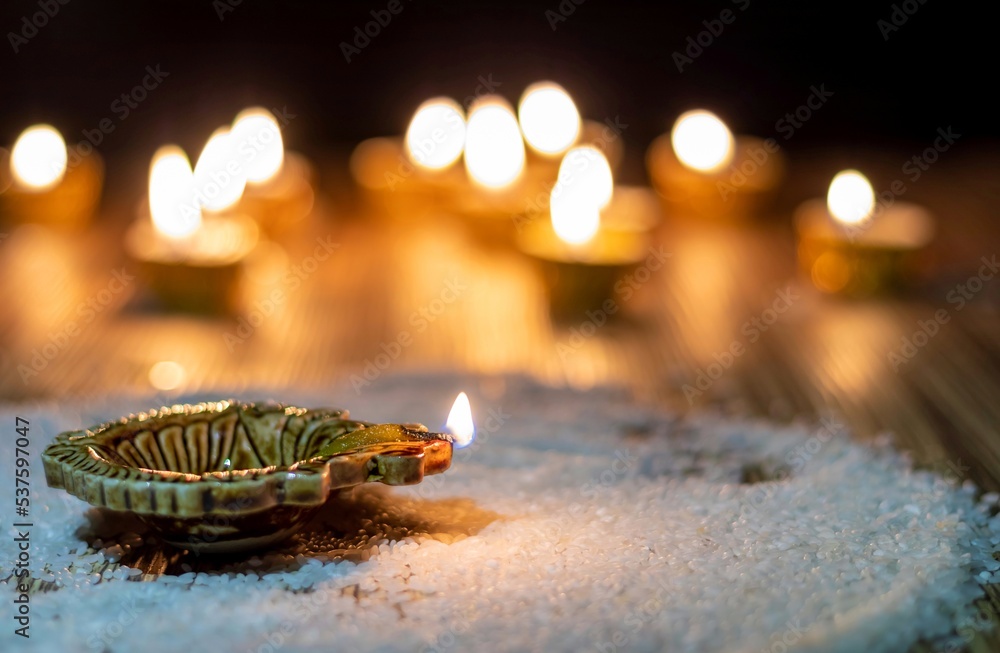 Diwali Festival Traditional Diya or Oil Lamp Lit Isolated on Rice with ...