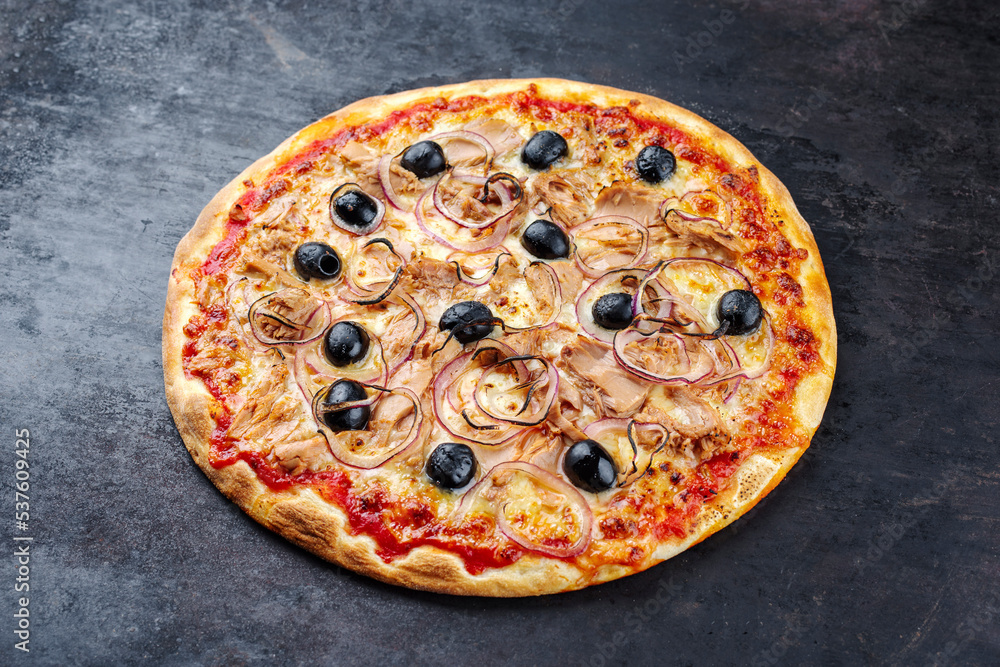 Traditional Italian pizza al tonno with tuna, onion and olives served ...