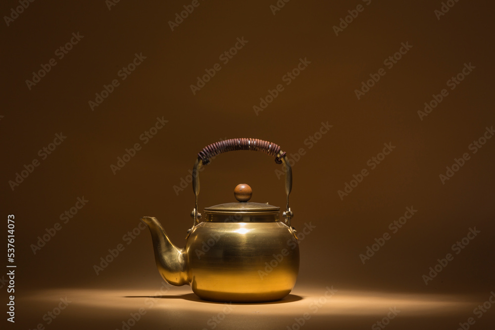 golden teapot on warm background, tea ceremony Stock Photo | Adobe Stock
