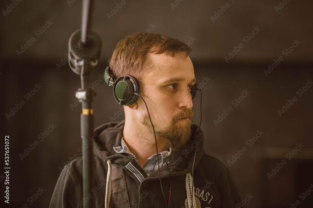 Sound engineer with a microphone on the set. A professional sound ...
