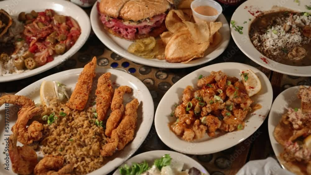 Variety of cajun creole comfort food dishes, tabletop filled with ...