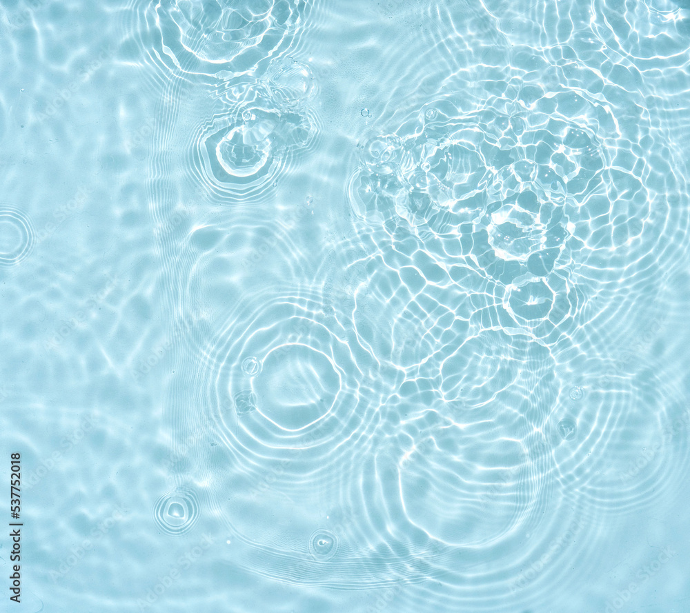 Original light background image of the water surface in shades of blue ...