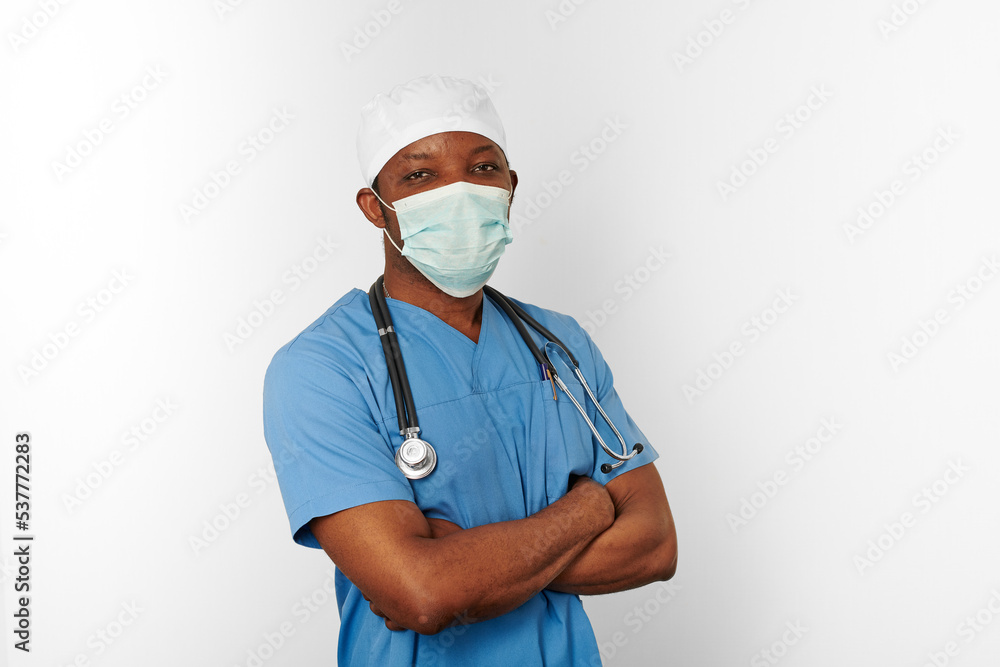 Black surgeon doctor man in blue coat white cap and surgeon mask with ...