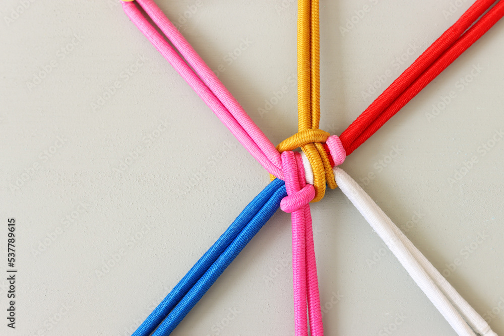 Concept image of unity and teamwork. Ropes tied together as a symbol of ...