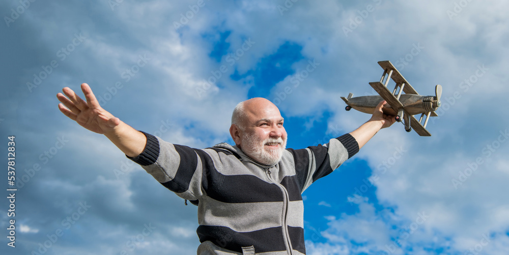 happy retirement. cheerful granddad with toy. retired old man outdoor ...
