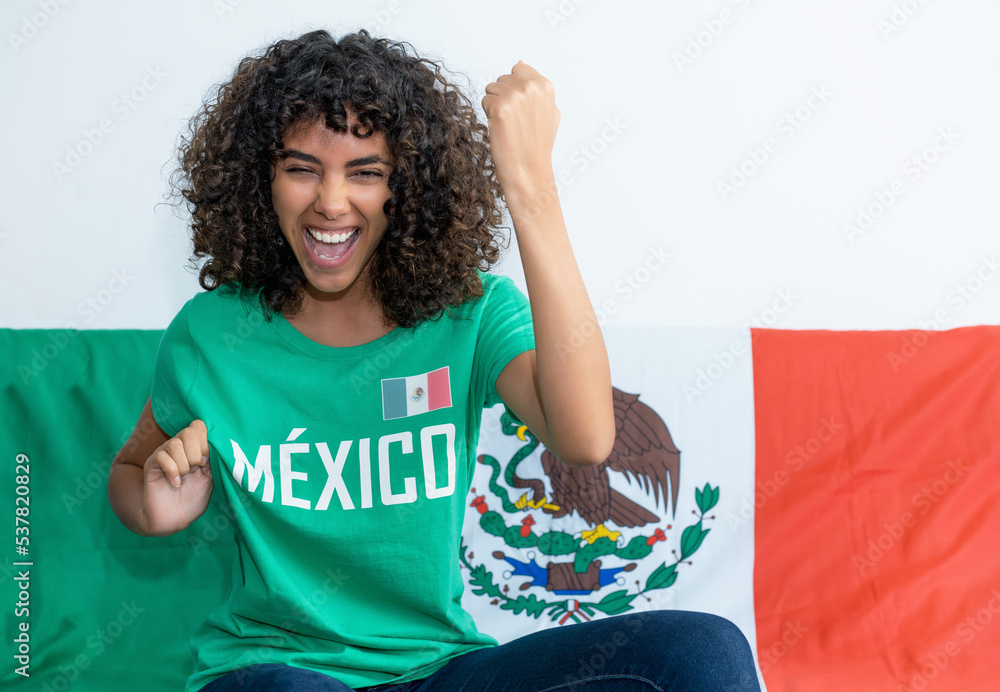 Cheering mexican female soccer fan with flag of Mexico Stock Photo ...