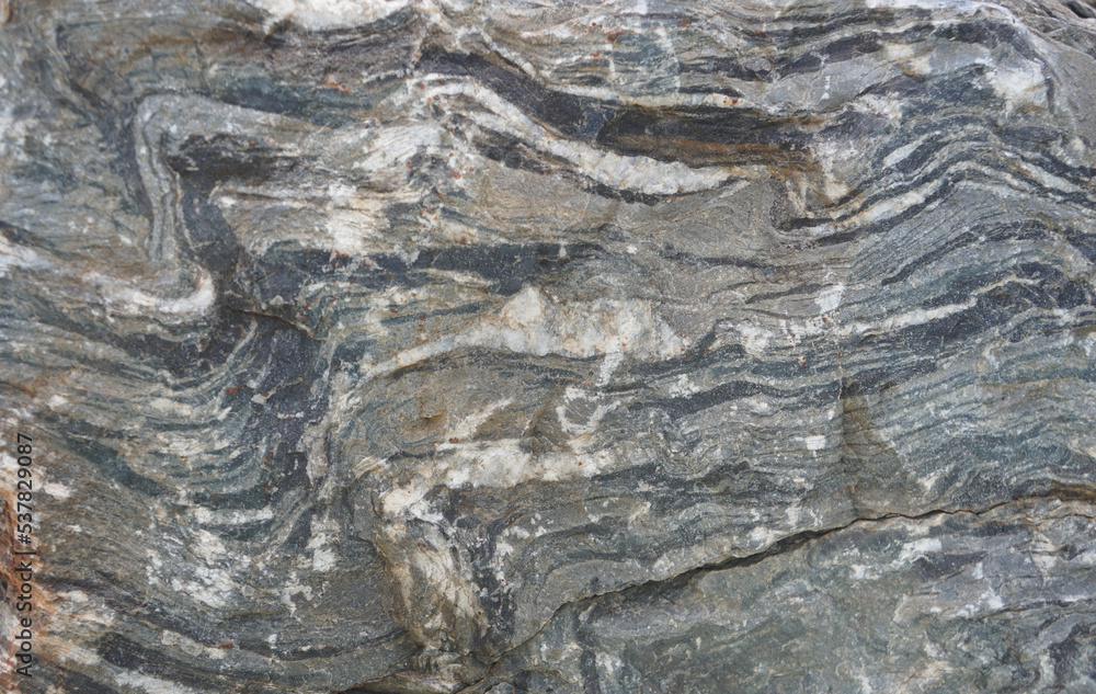 Abstract texture of gneiss foliated metamorphic rock background. it has ...