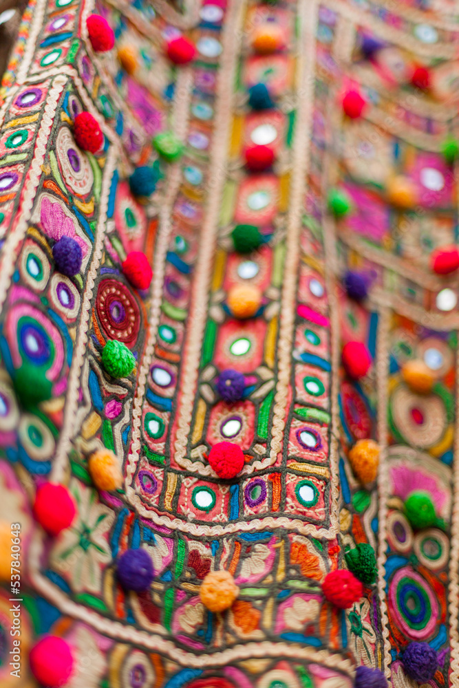Details of embroidered traditional dress, ornemented with mirrors ...