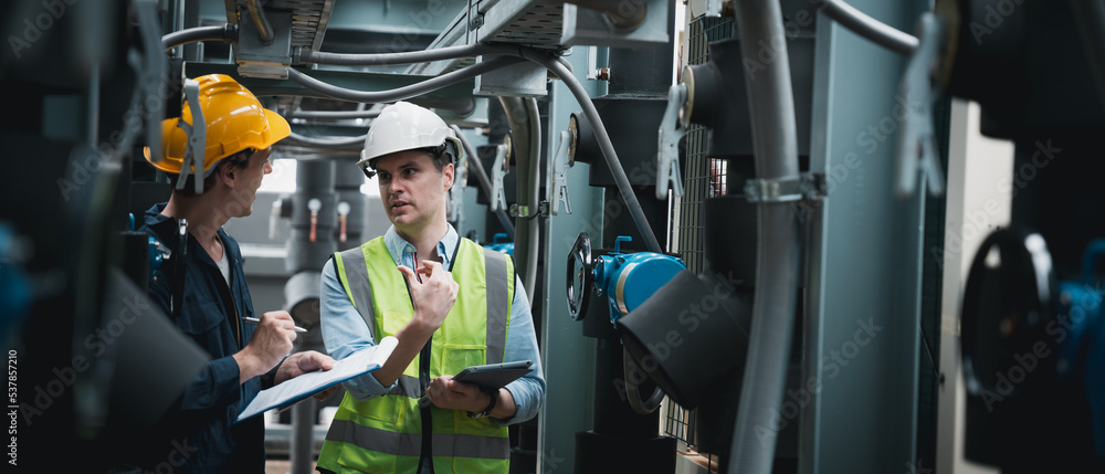Engineer and team examining the air conditioning cooling system of a ...