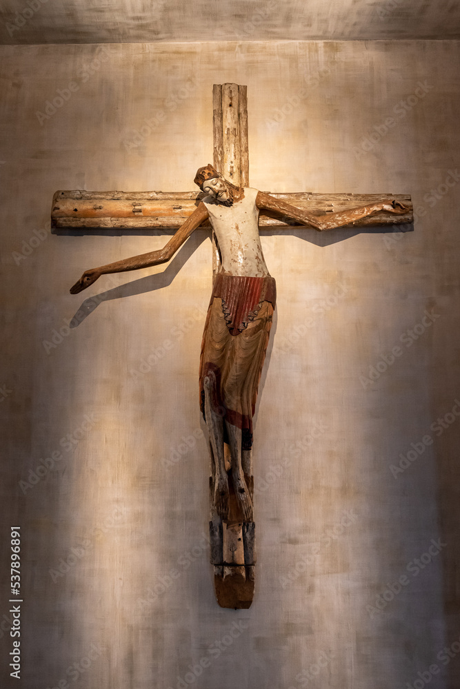 Medieval wooden crucifix showing one of Jesus´ s arms falling from the ...