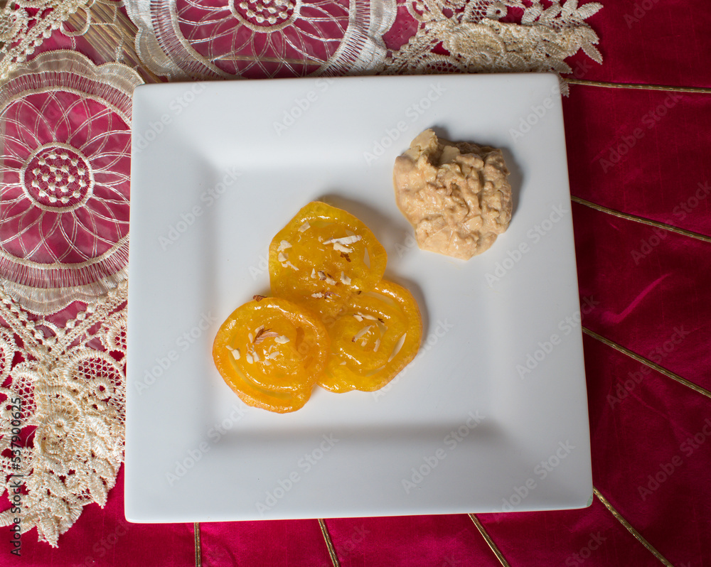 Home Made Jalebi with mishti doi or dahi in white plate with beautiful ...