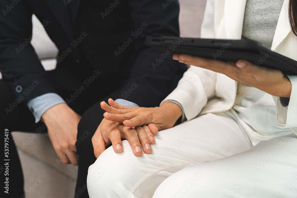 Unhappy asian young employee, business woman defending hand of ...