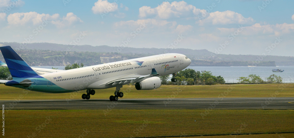 Garuda Indonesia aircraft while take off from Ngurah Rai International ...