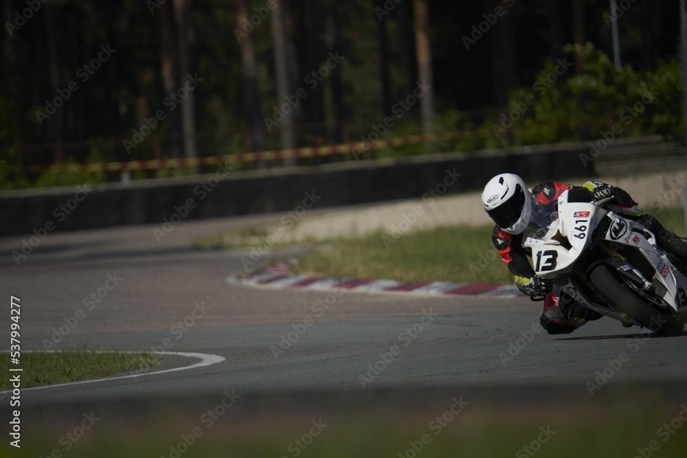 12-09-2022 Riga, Latvia a person riding a motorcycle on a race track, a ...